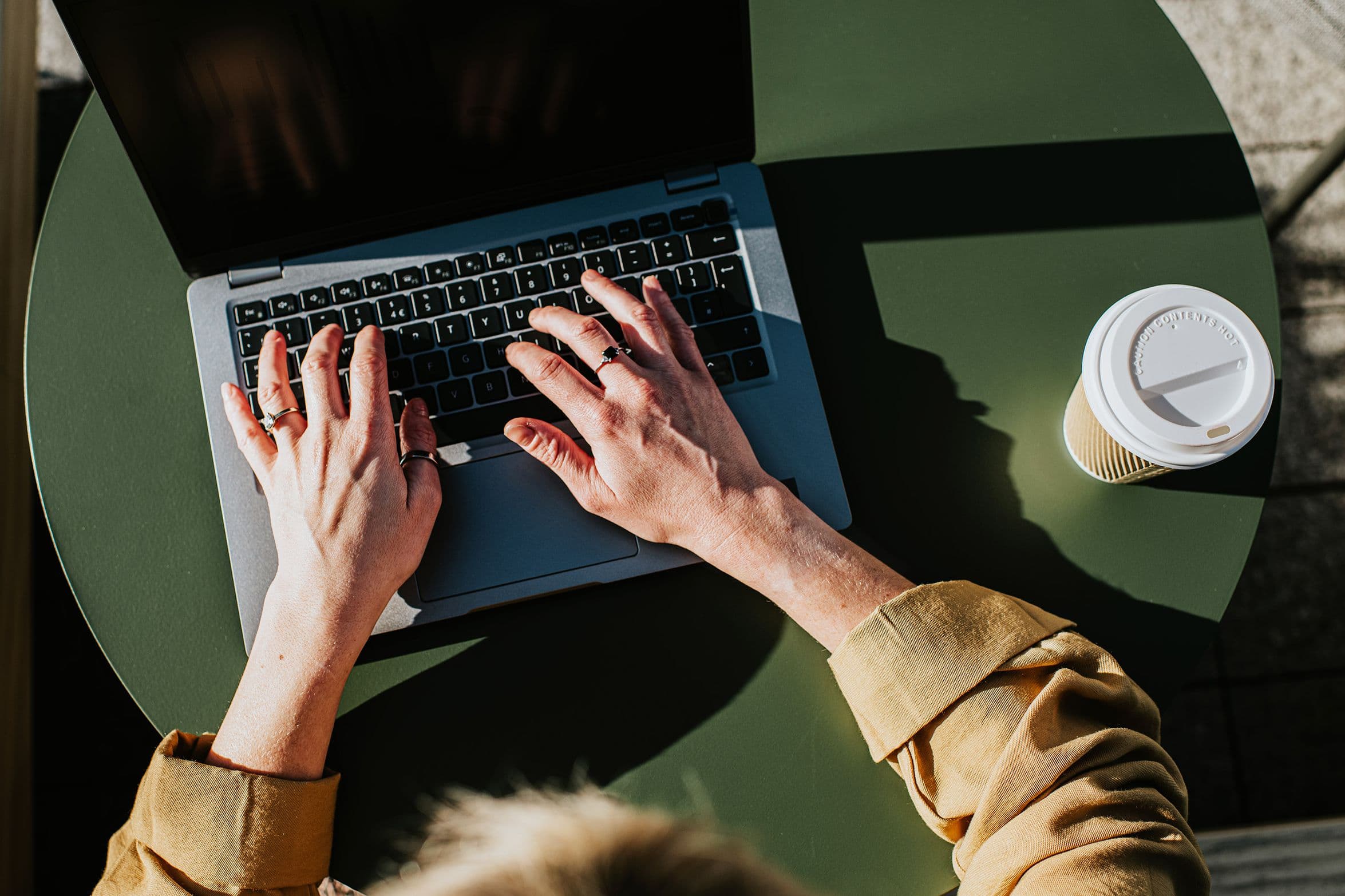 Freelancer on laptop managing client work remotely