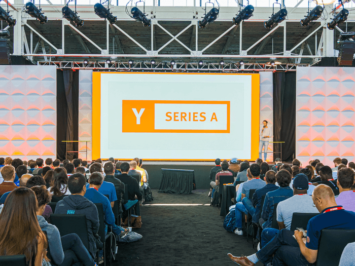 Y Combinator Demo Day — founders pitching their startups to investors, a scene that now includes many AI-built MVPs
